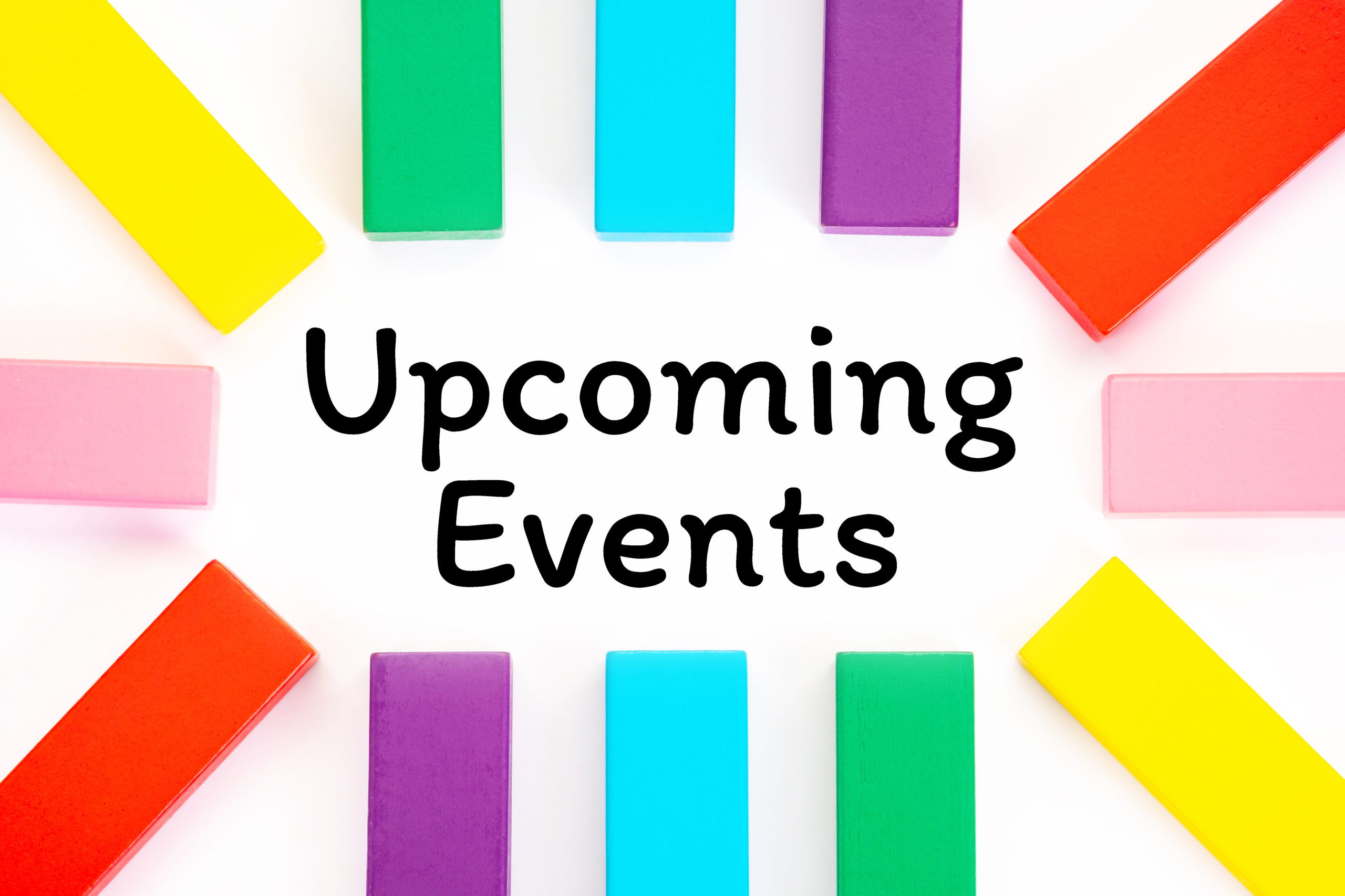 Upcoming Events written on a white paper with a colorful wooden blocks ...